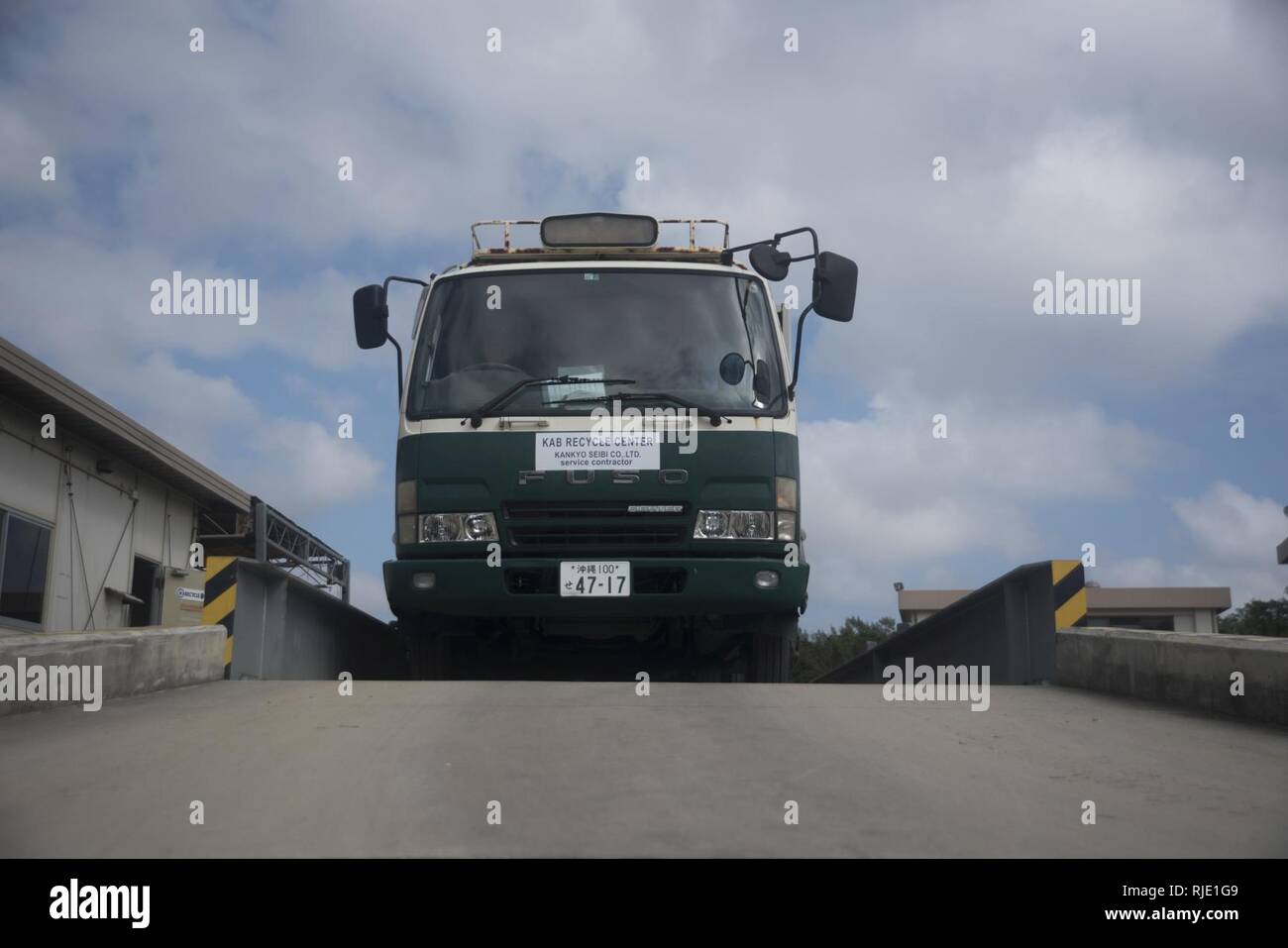 A trash collection truck parks on a scale prior to offloading Jan. 18 ...