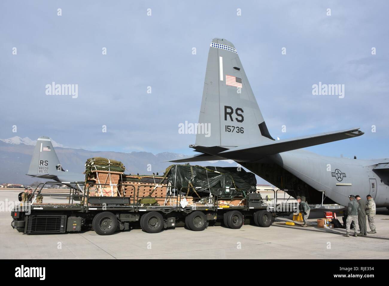 An M777 Howitzer is loaded onto a C-130 Hercules at Aviano Air Base in ...