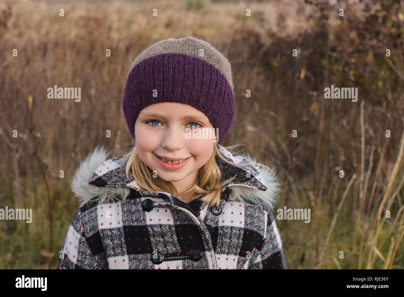 beautiful young school age girl dressed for late fall early winter ...