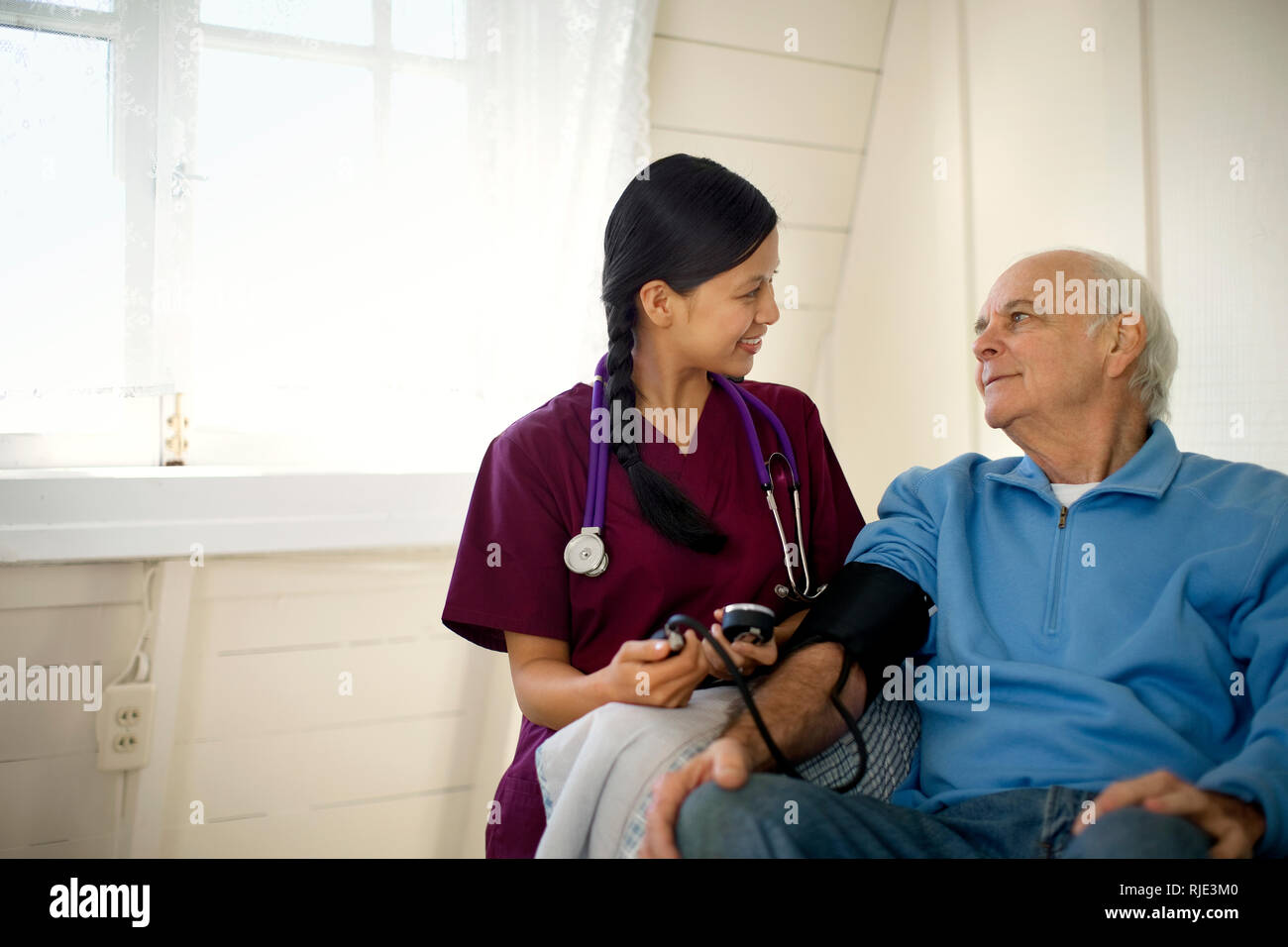 Black woman blood pressure nurse hi-res stock photography and images ...