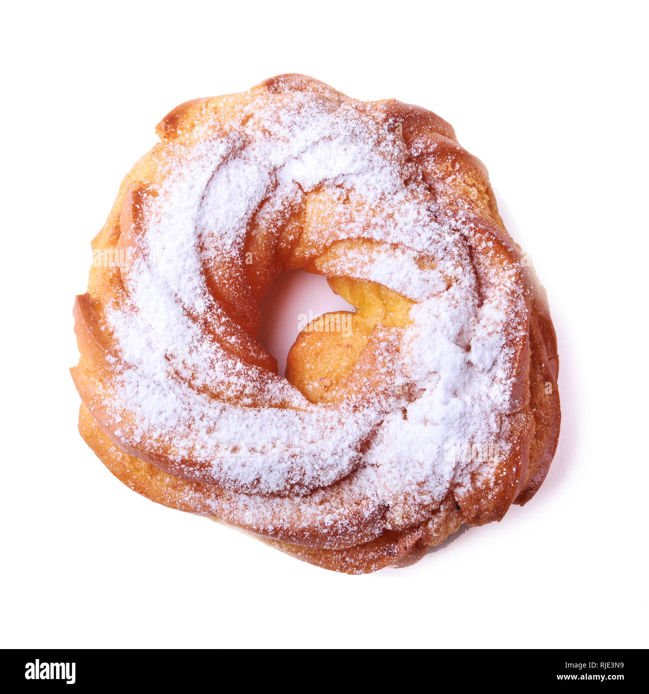 Chocolate and powdered sugar cream puff rings, choux pastry. Isolated ...