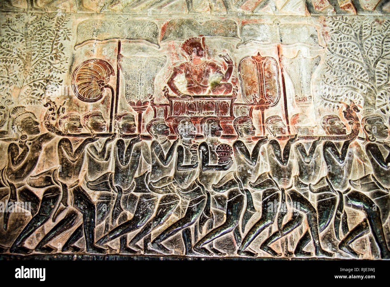 Detail of stone relief carving of Ramayana royal procession at Angkor ...