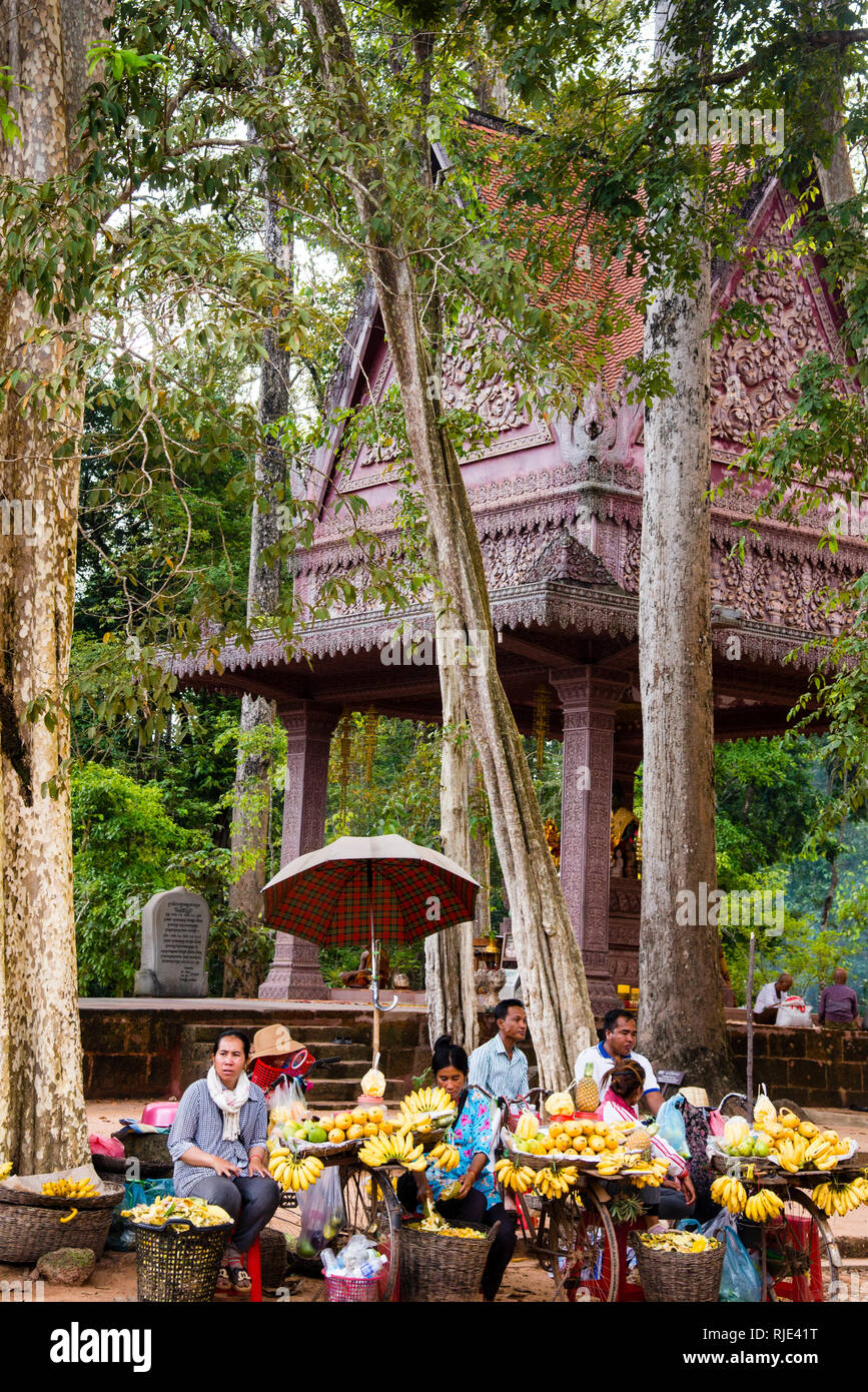 Cambodian fruit vendors and Buddhist shrine near Angkor Thom in Angkor ...