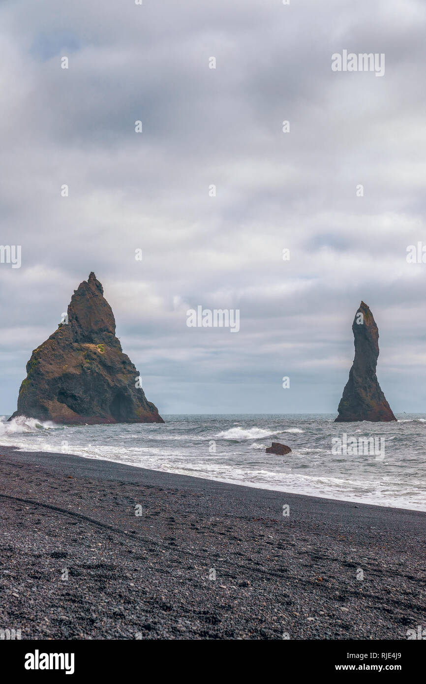 Reynisfjara (black sand beach) and Reynisdrangar (basalt sea stacks) in ...