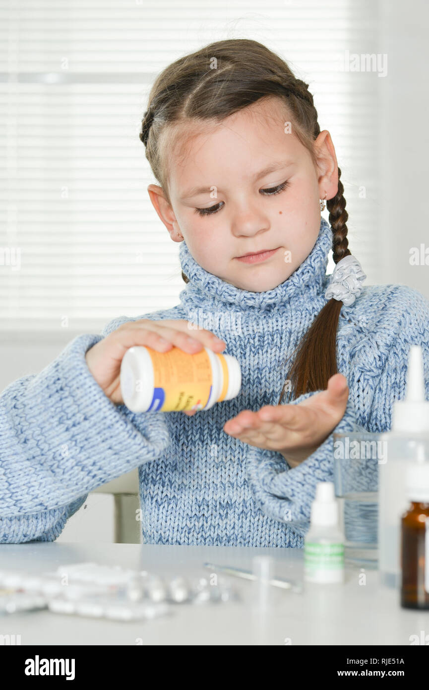 Child taking medication hi-res stock photography and images - Alamy