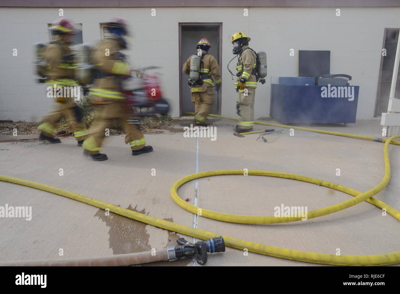 Airmen assigned to the 56th Civil Engineer Squadron enter a building during structural ...