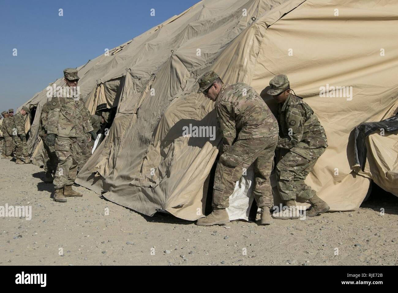 CAMP ARIFJAN, Kuwait – 35th Infantry Division Soldiers work together ...