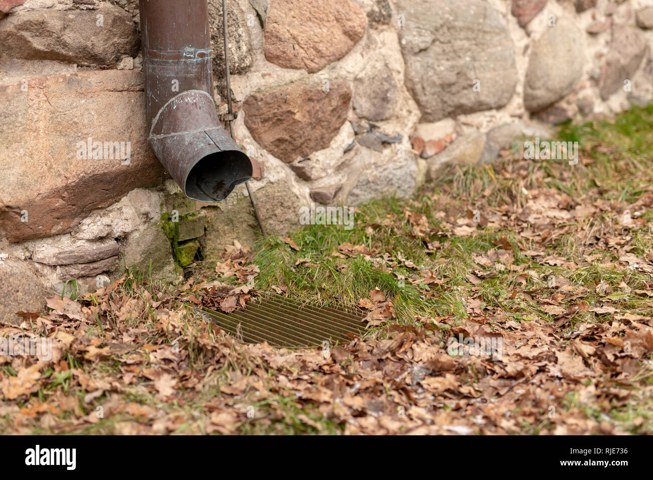 Old copper drain gutter in a brick building. Installation that drains ...