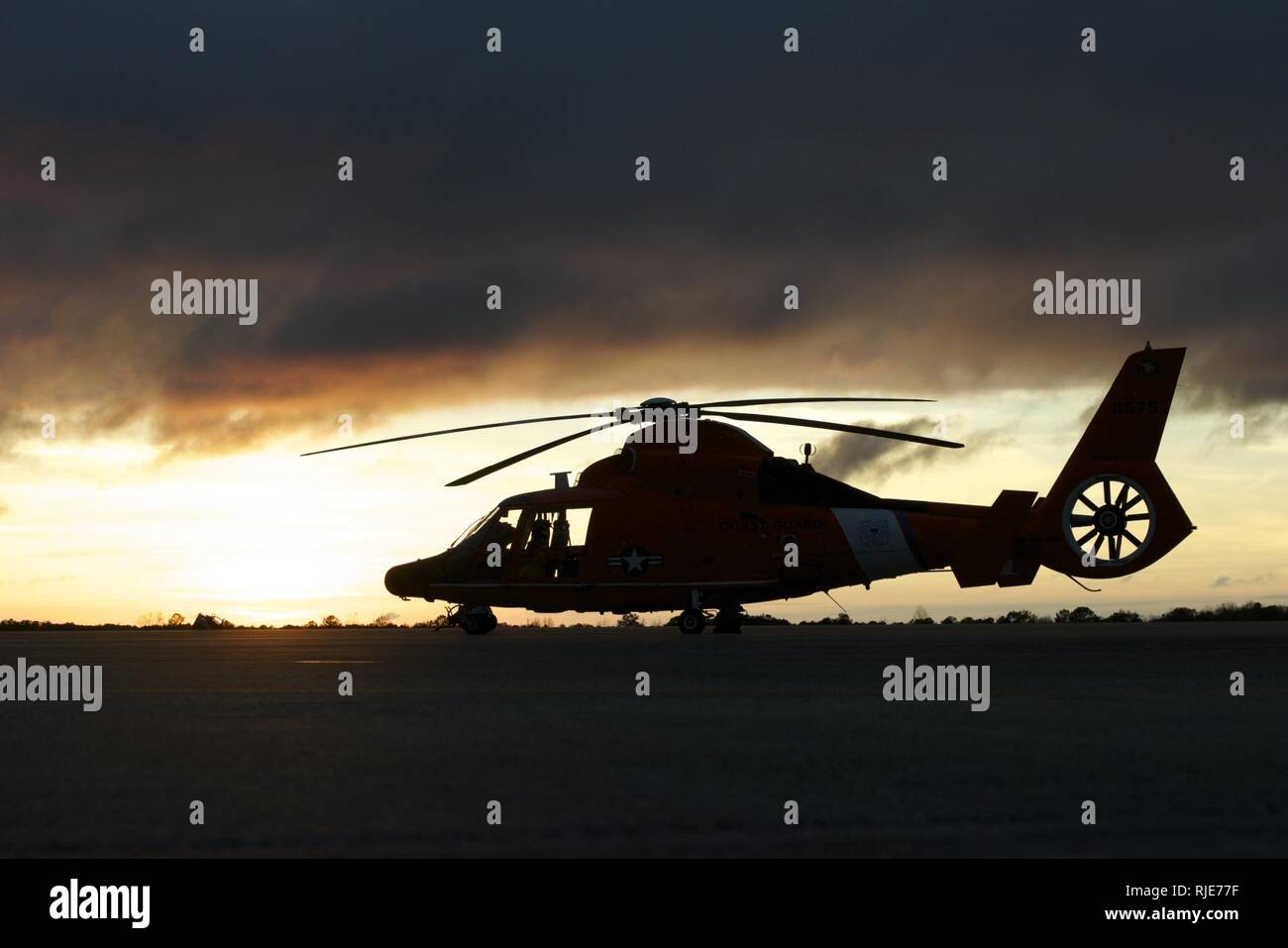 A Coast Guard Aviation Training Center Mobile MH-65 Dolphin helicopter ...