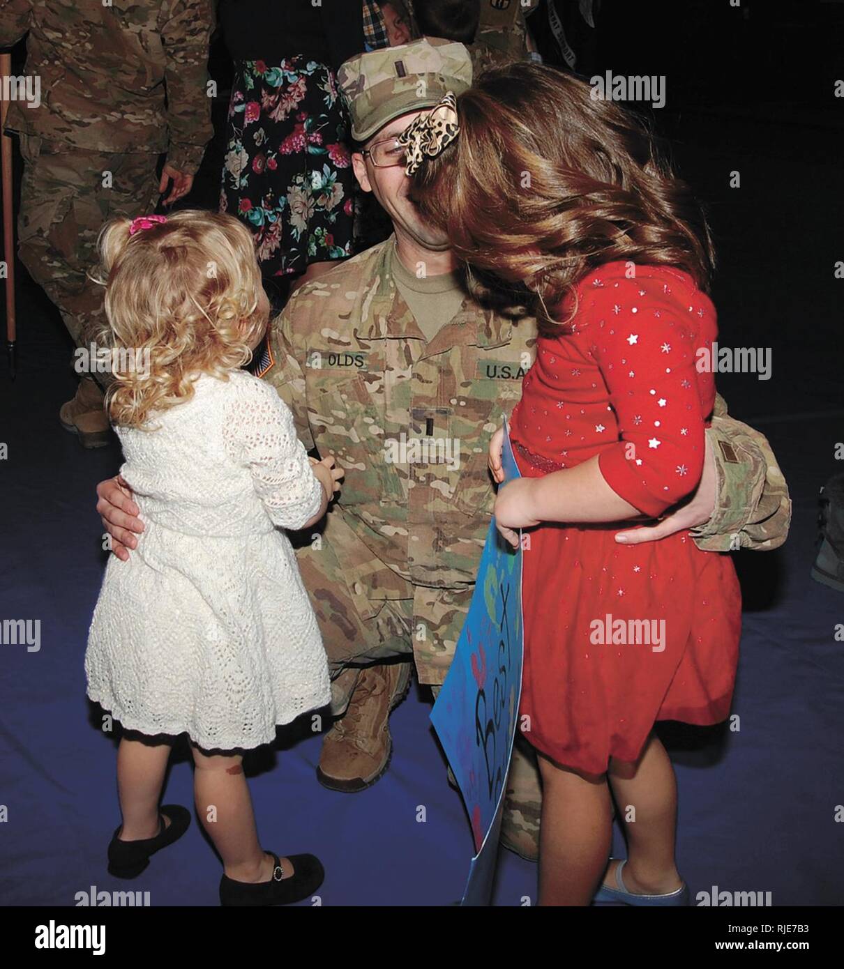 First Lt. Greg Olds hugs his daughters Ava, 5, and Grace, 2 Stock Photo ...