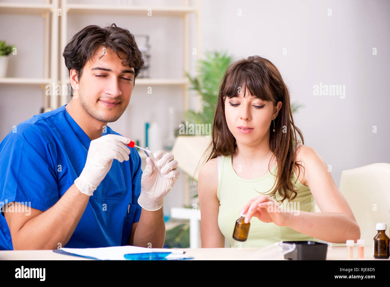 Doctor getting saliva test sample in clinic hospital Stock Photo - Alamy