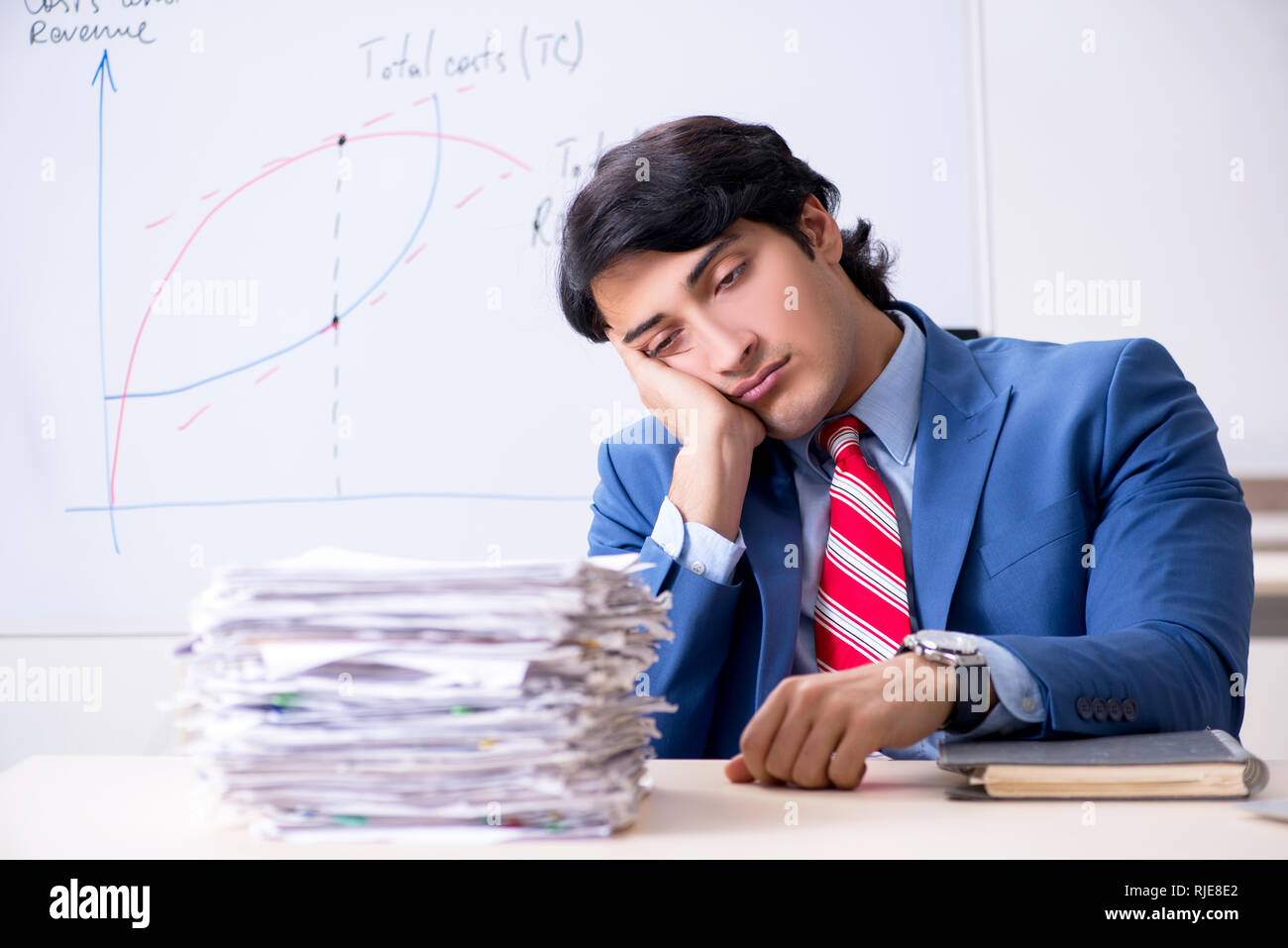 Busy businessman explaining business charts Stock Photo - Alamy