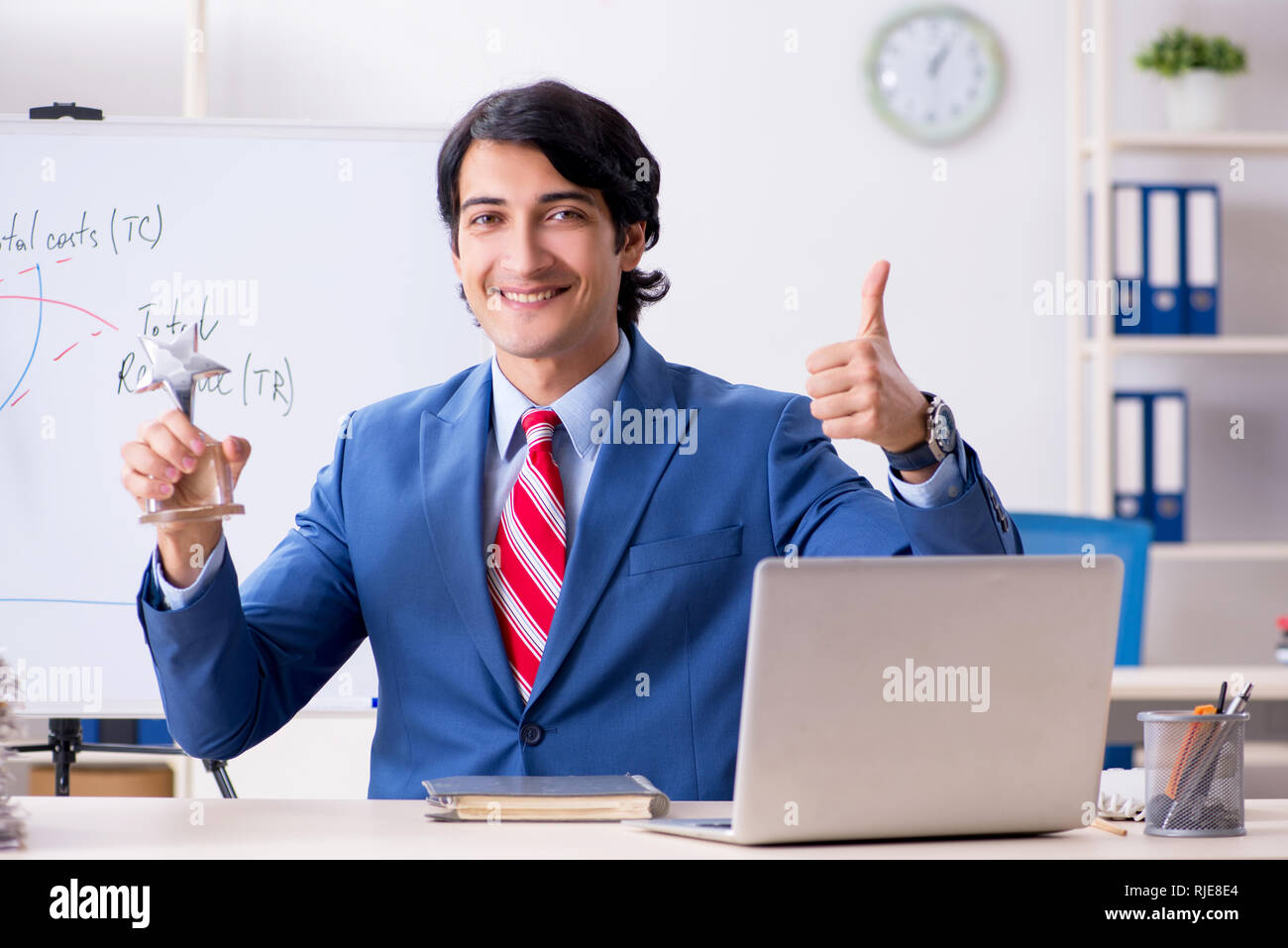 Busy businessman explaining business charts Stock Photo - Alamy