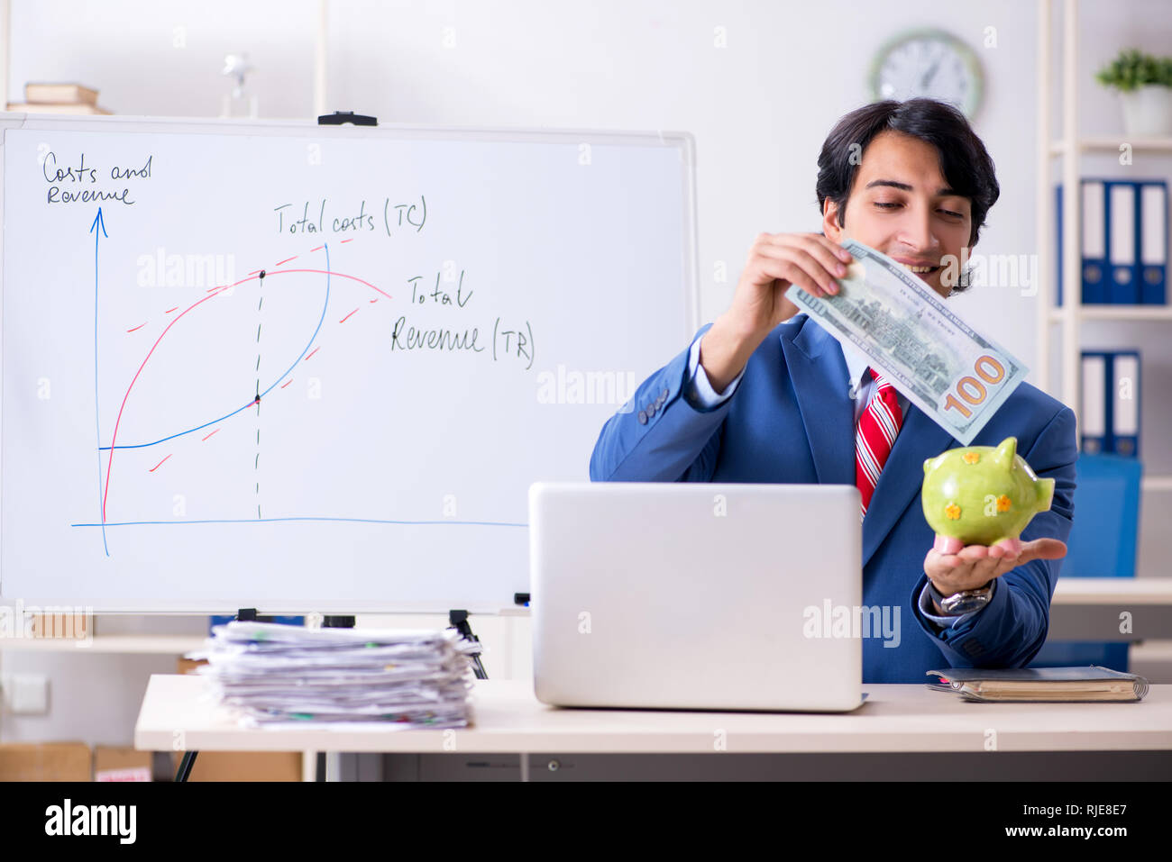Busy businessman explaining business charts Stock Photo - Alamy