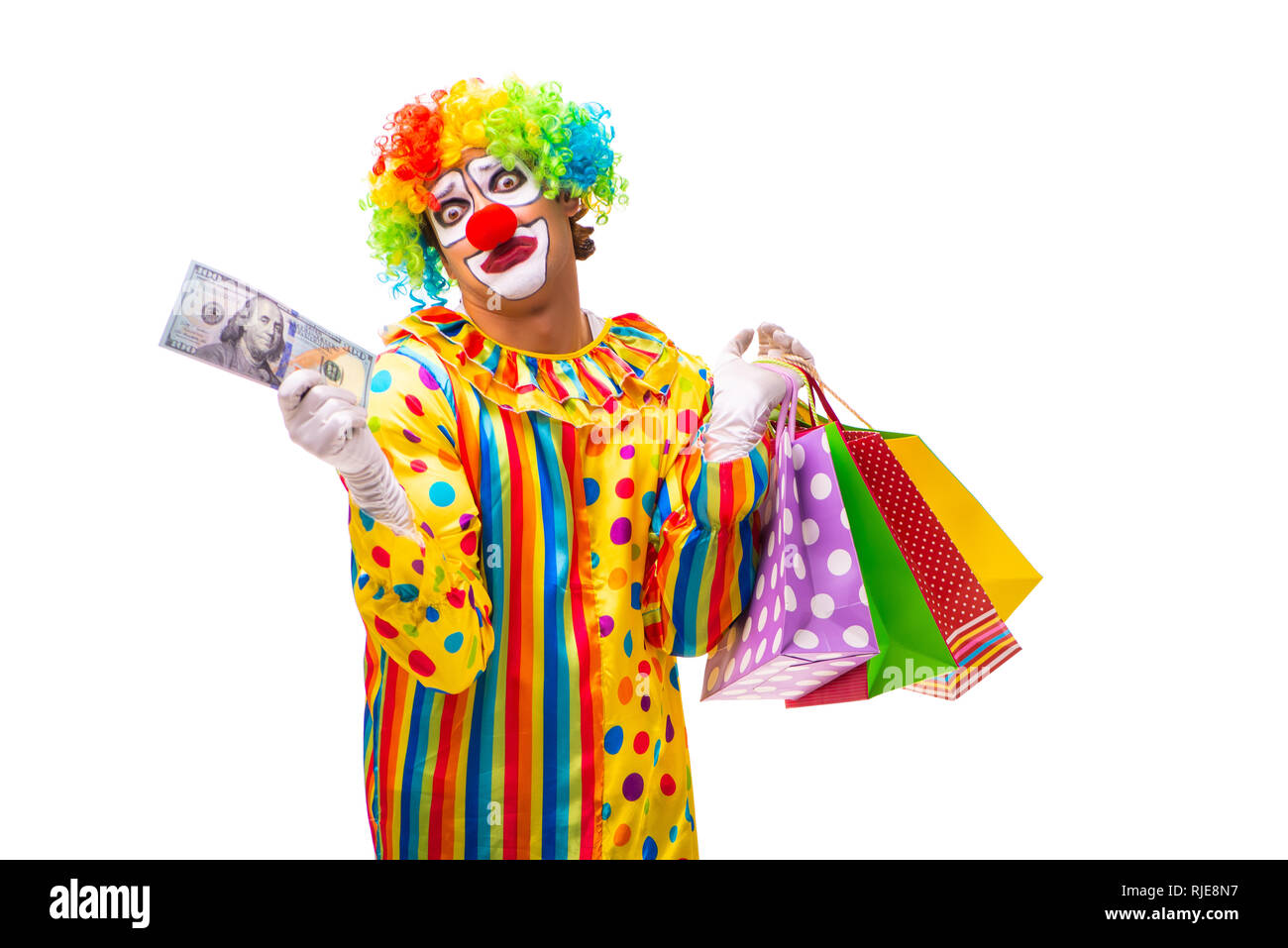 Happy male clown holding present hi-res stock photography and images ...