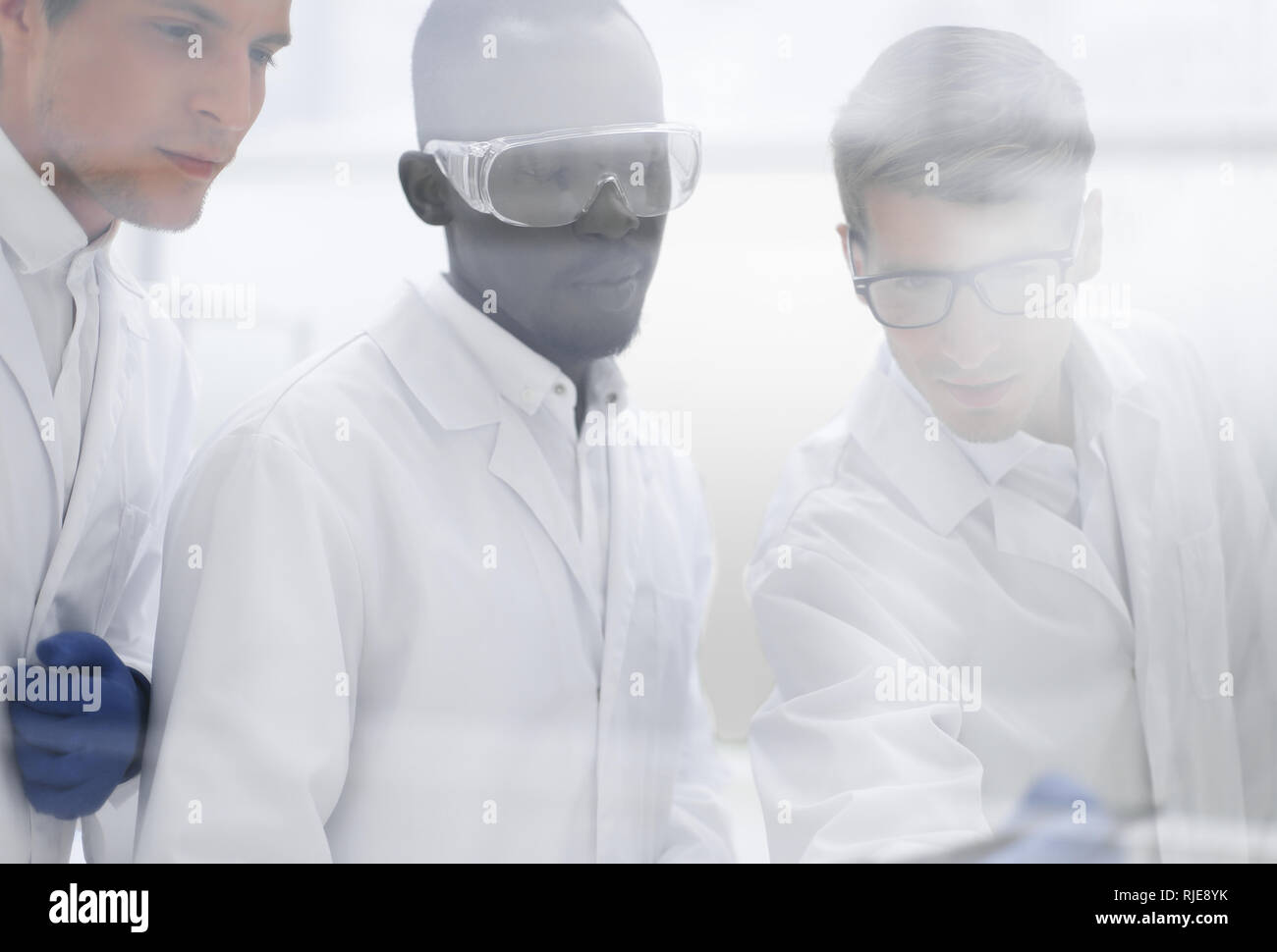 Scientists look at board hi-res stock photography and images - Alamy