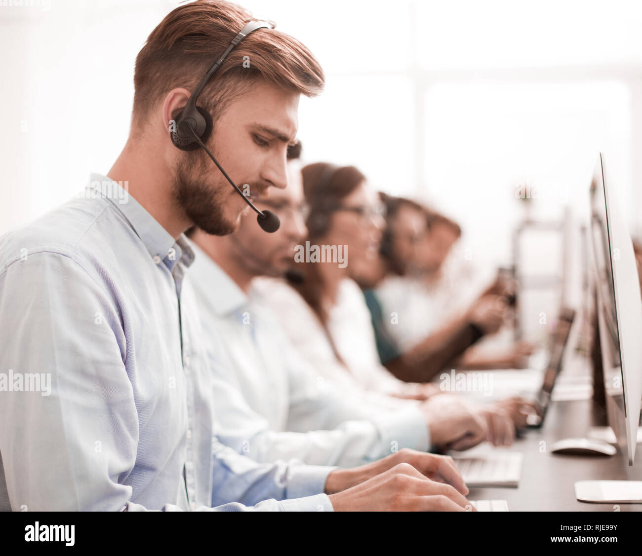 Call center male worker answer hi-res stock photography and images - Alamy