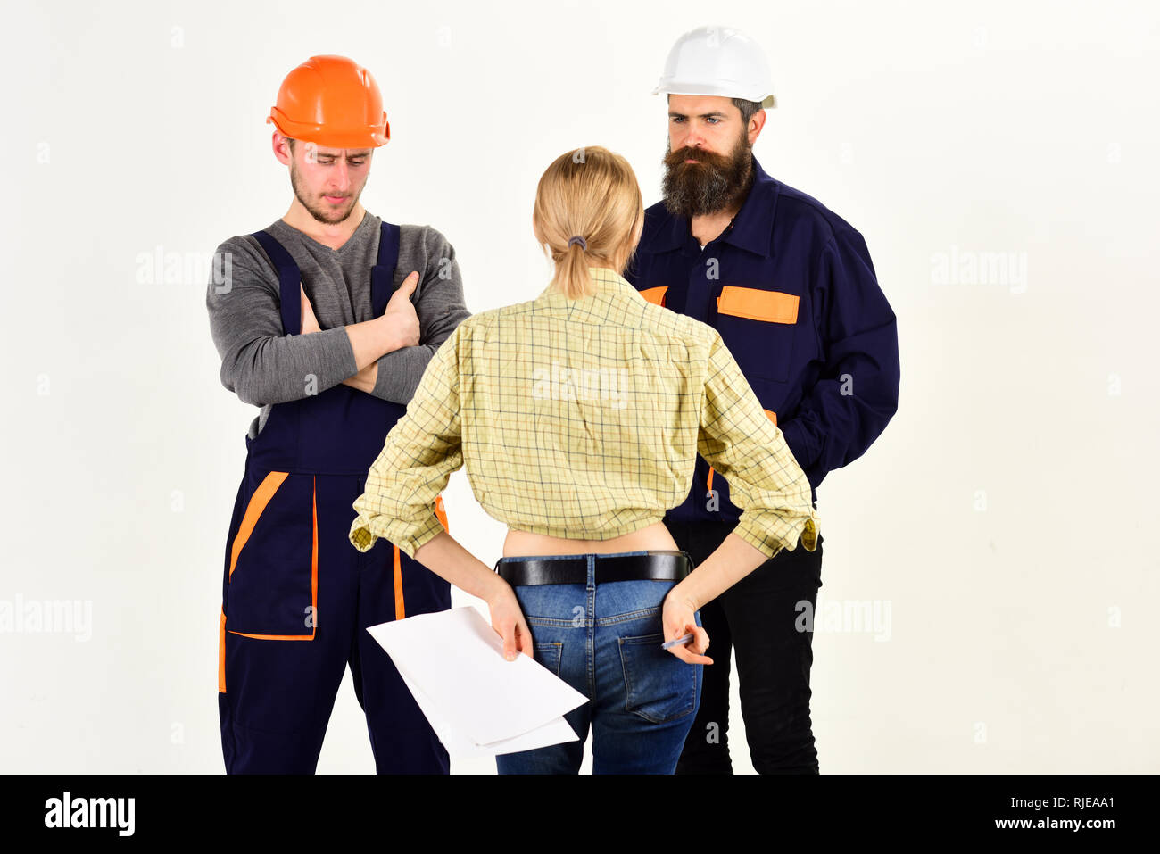 The team to build with. Men and woman builders working in team ...
