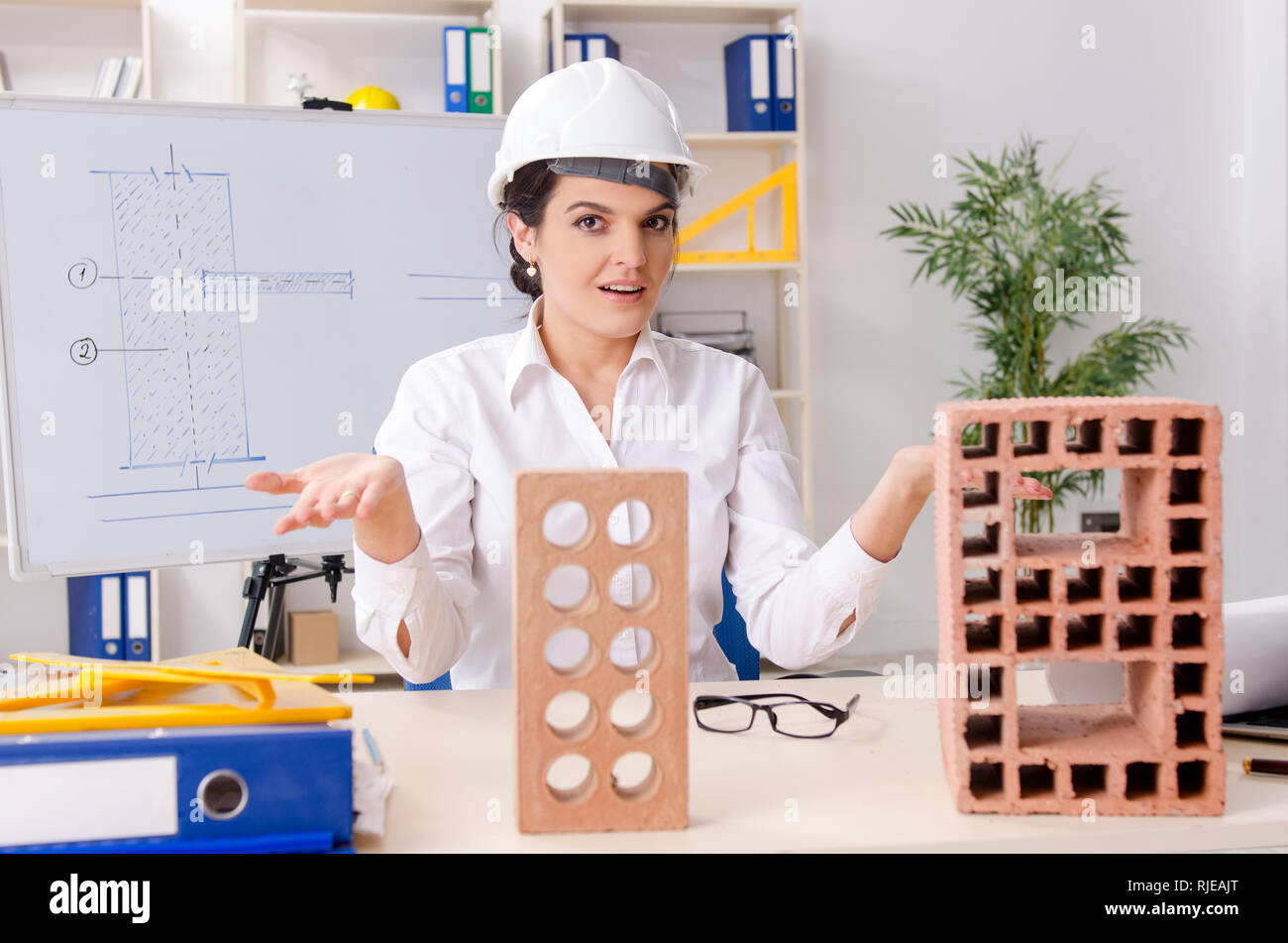 Female architect working in the office Stock Photo - Alamy