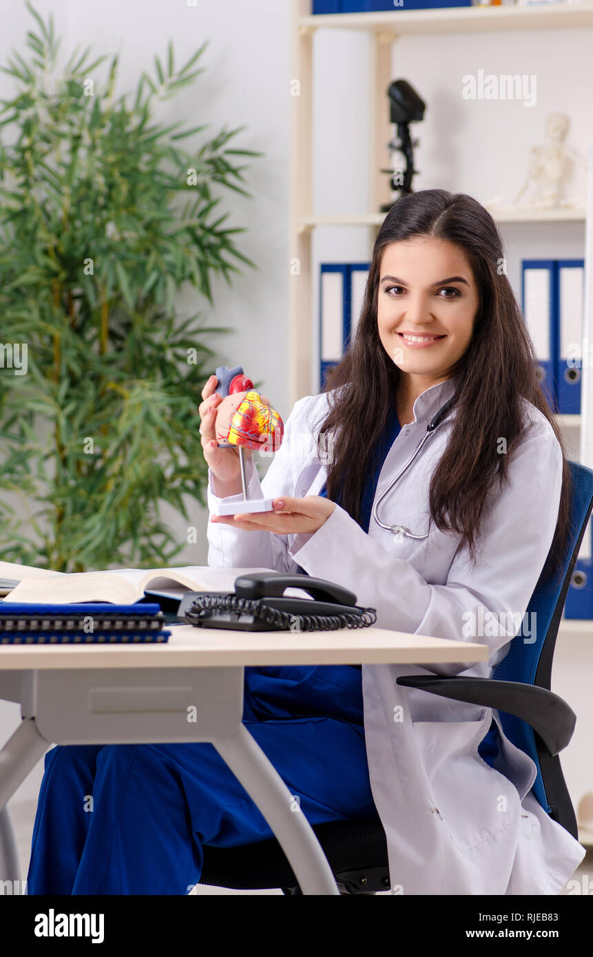 Female doctor cardiologist working in the clinic Stock Photo - Alamy