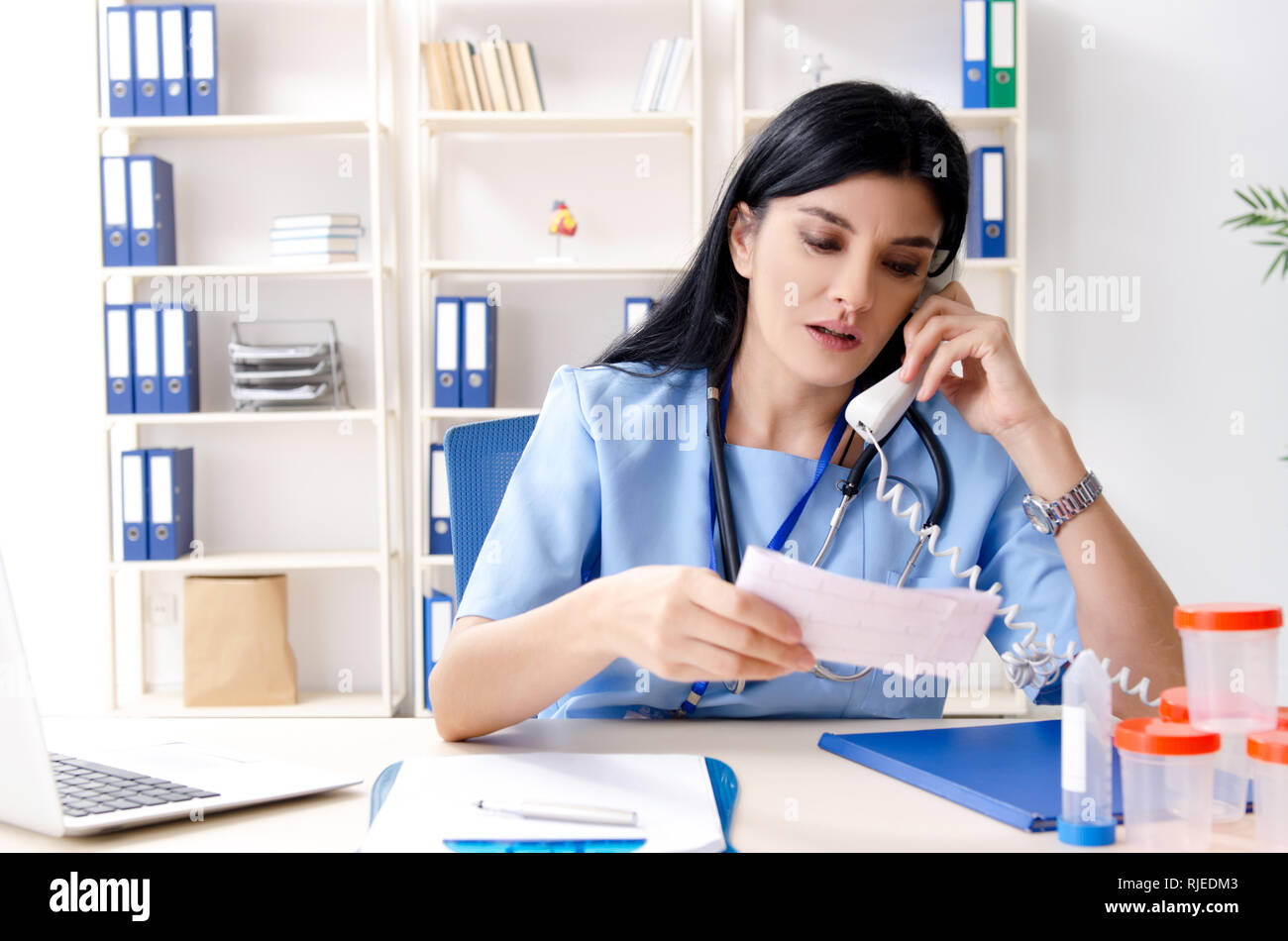 Female doctor cardiologist working in the clinic Stock Photo - Alamy