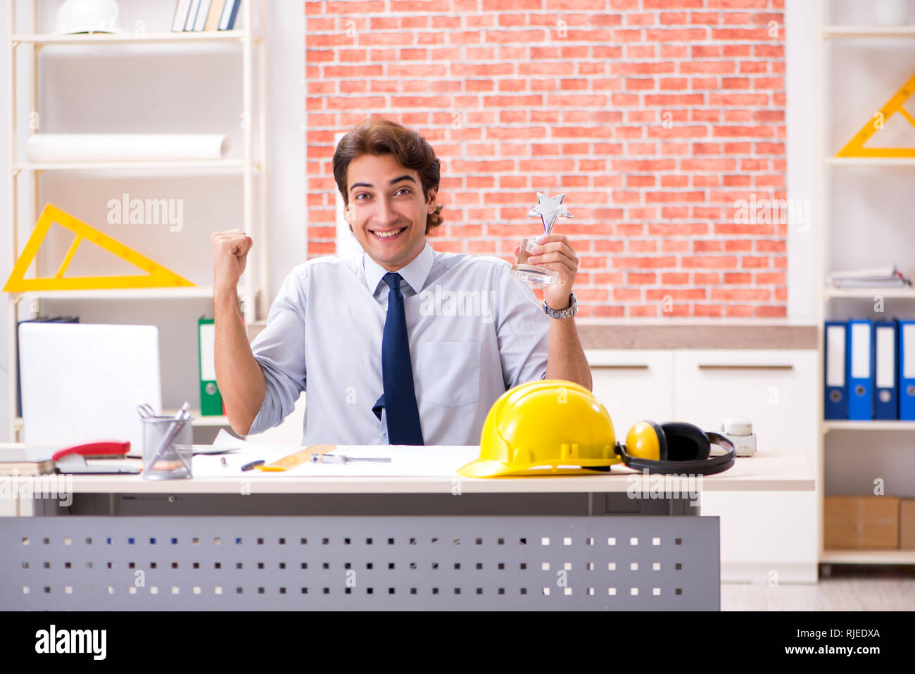 Construction supervisor working on blueprints Stock Photo - Alamy