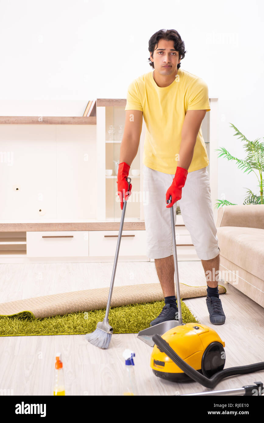 Frustrated man doing housework hi-res stock photography and images - Alamy
