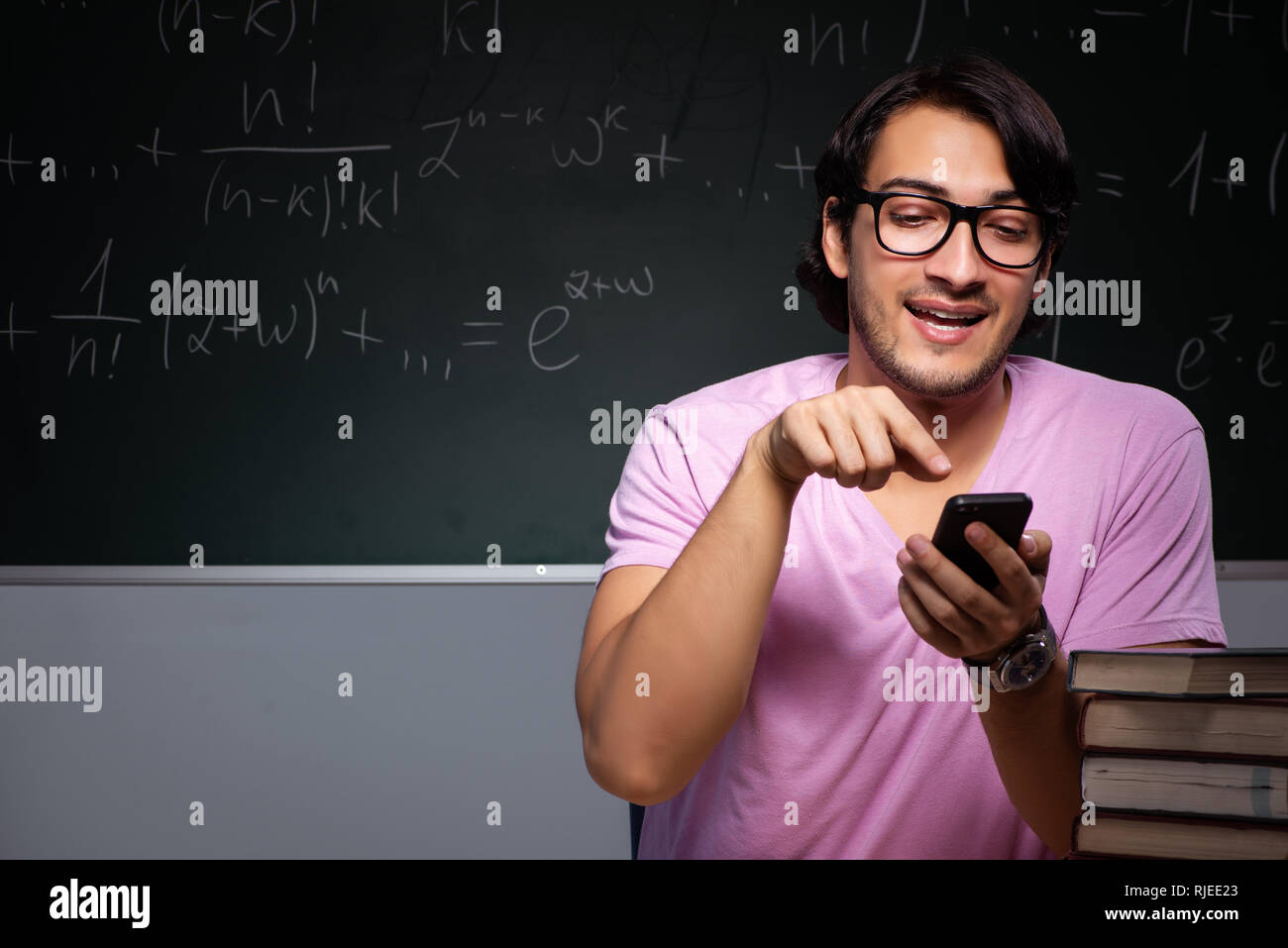 High school student texting in class hi-res stock photography and ...