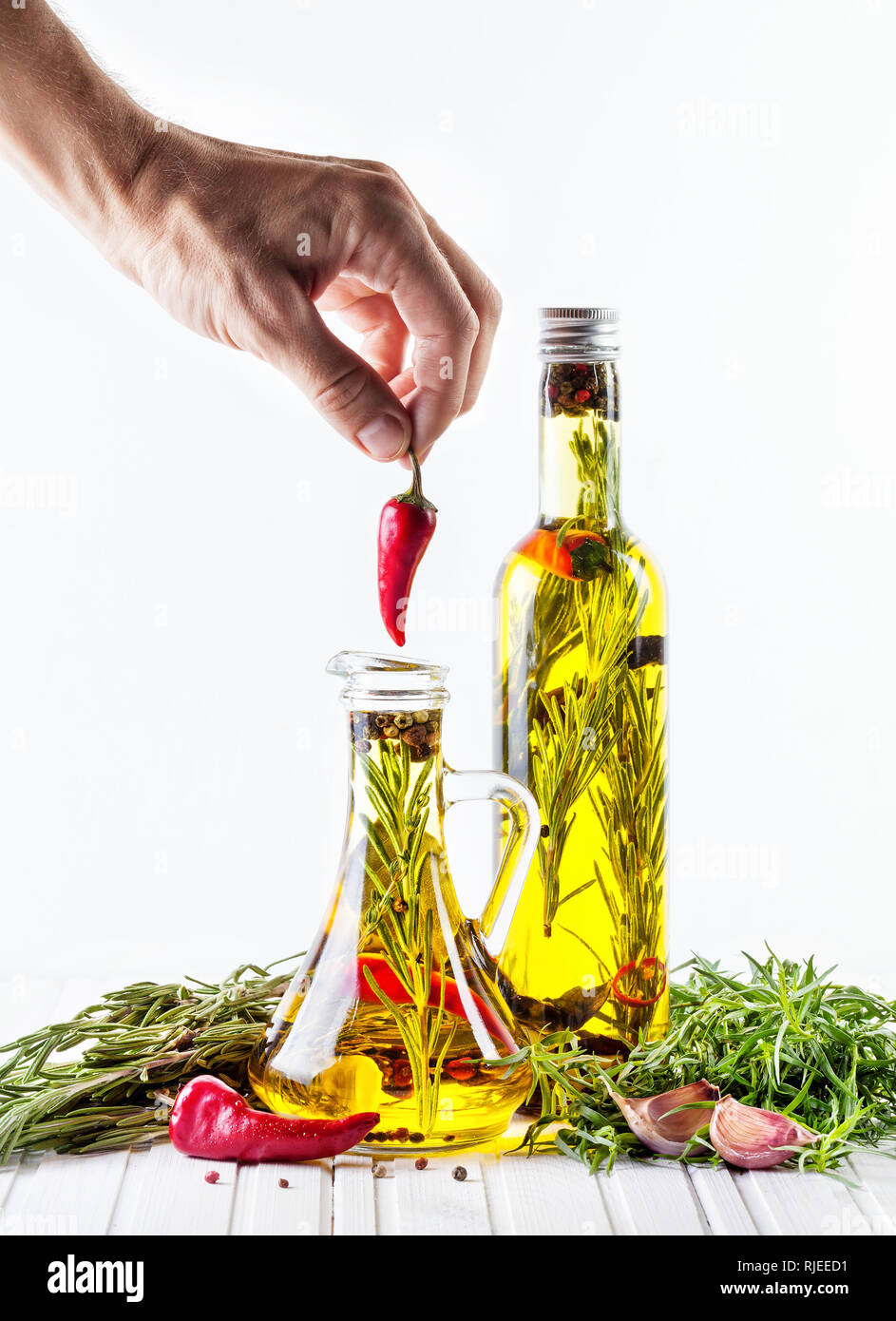 Man putting red chili pepper hi-res stock photography and images - Alamy