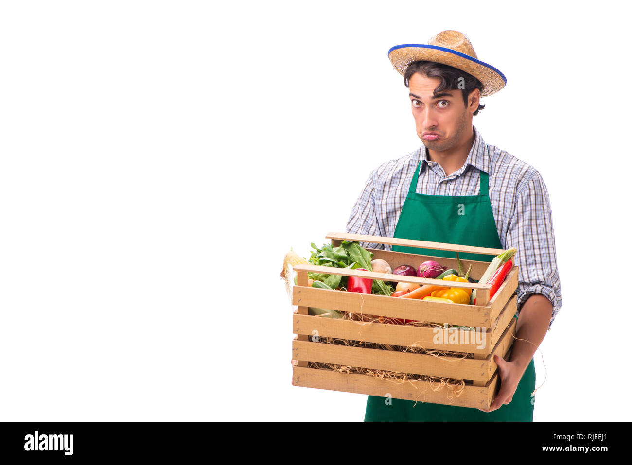 Young farmer with fresh produce isolated on white background Stock ...