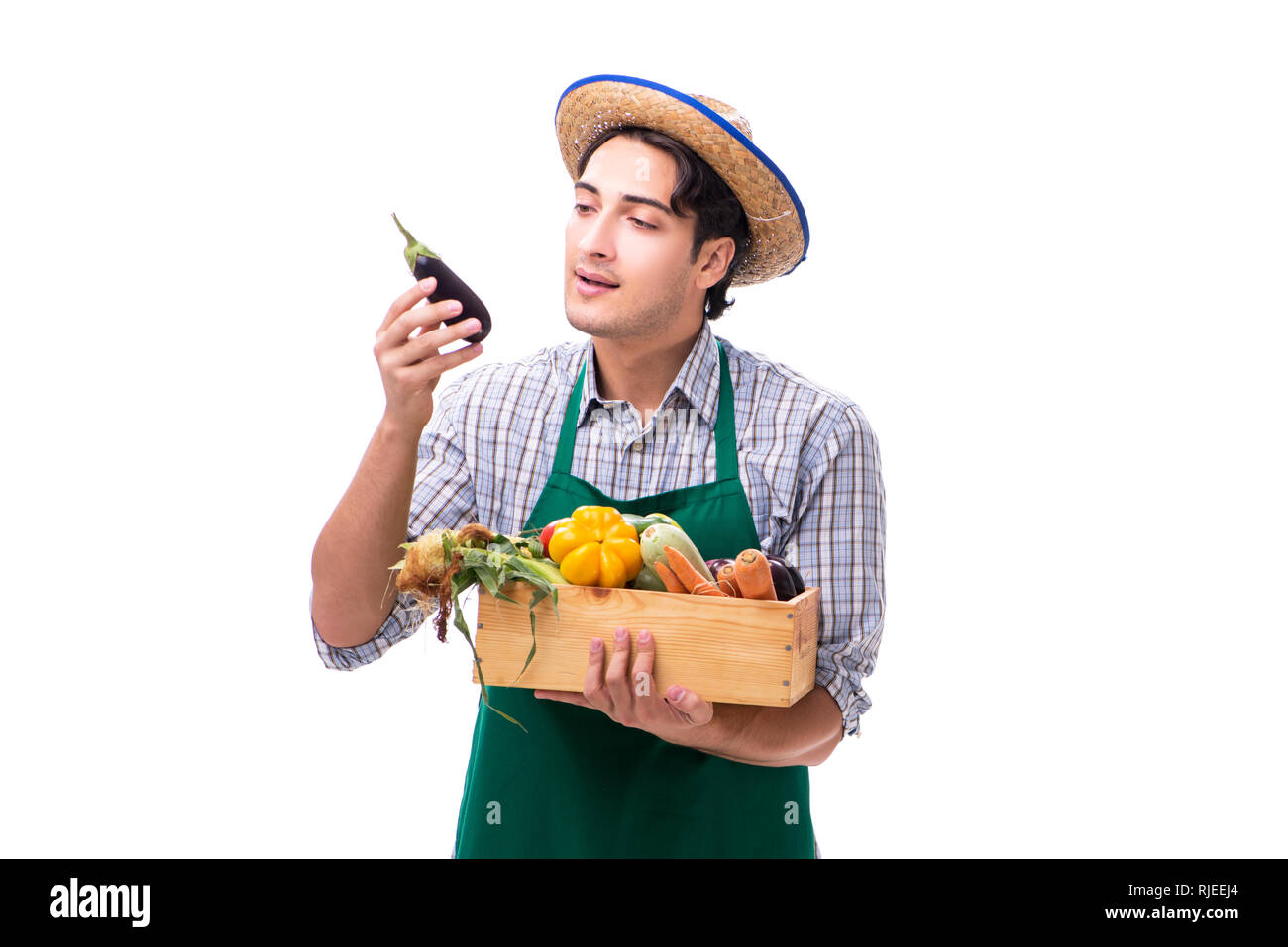 Young farmer with fresh produce isolated on white background Stock ...