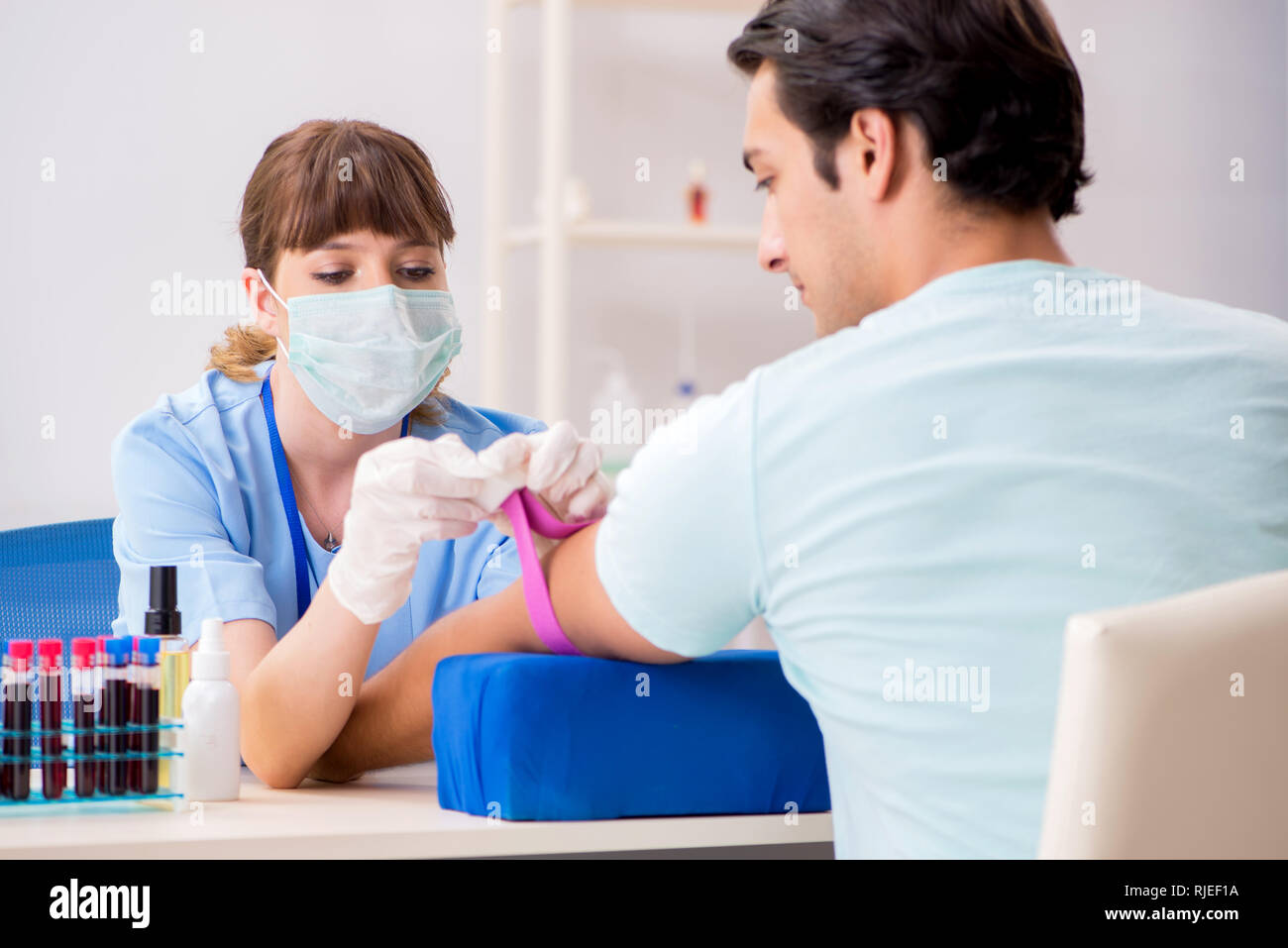 Young patient during blood test sampling procedure Stock Photo - Alamy