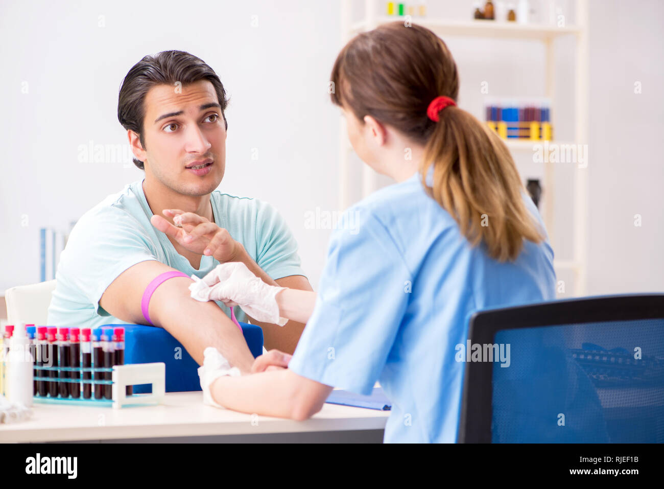 Young patient during blood test sampling procedure Stock Photo - Alamy