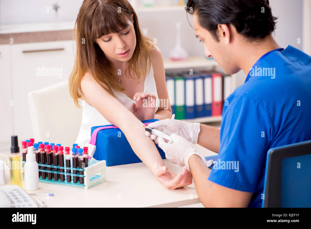 Young patient during blood test sampling procedure Stock Photo - Alamy