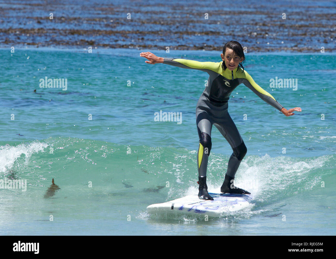 Surfing kids hi-res stock photography and images - Alamy