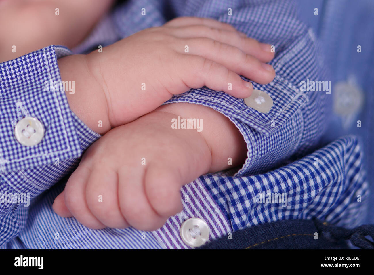 Newborn baby child close soft focus portrait of tiny tender skin hands ...