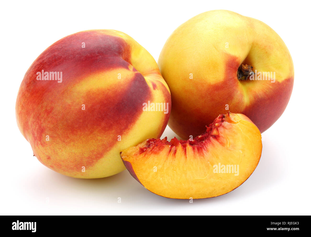 Nectarine peaches with slice isolated on white background Stock Photo ...