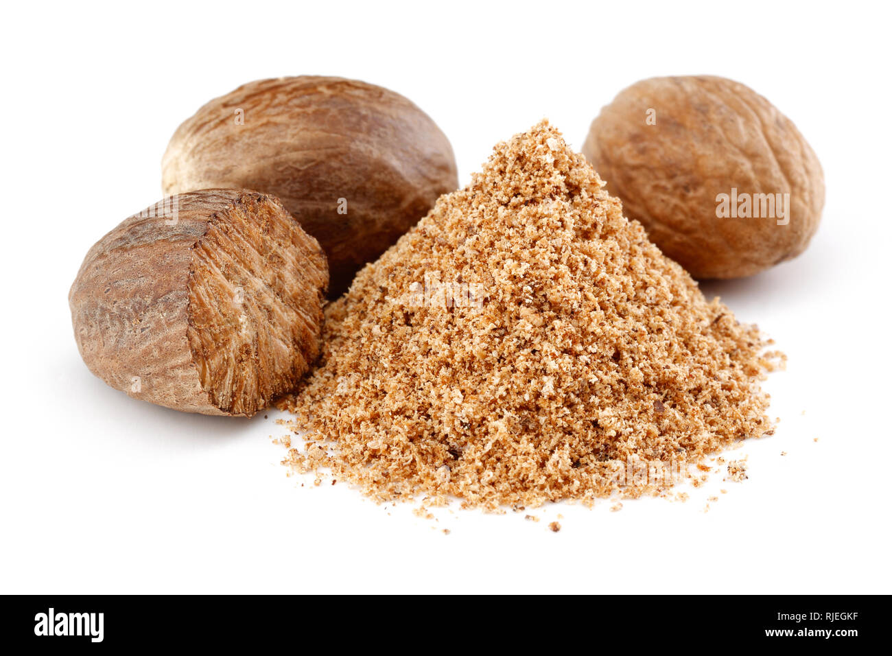 Whole and grated nutmeg isolated on white background Stock Photo - Alamy