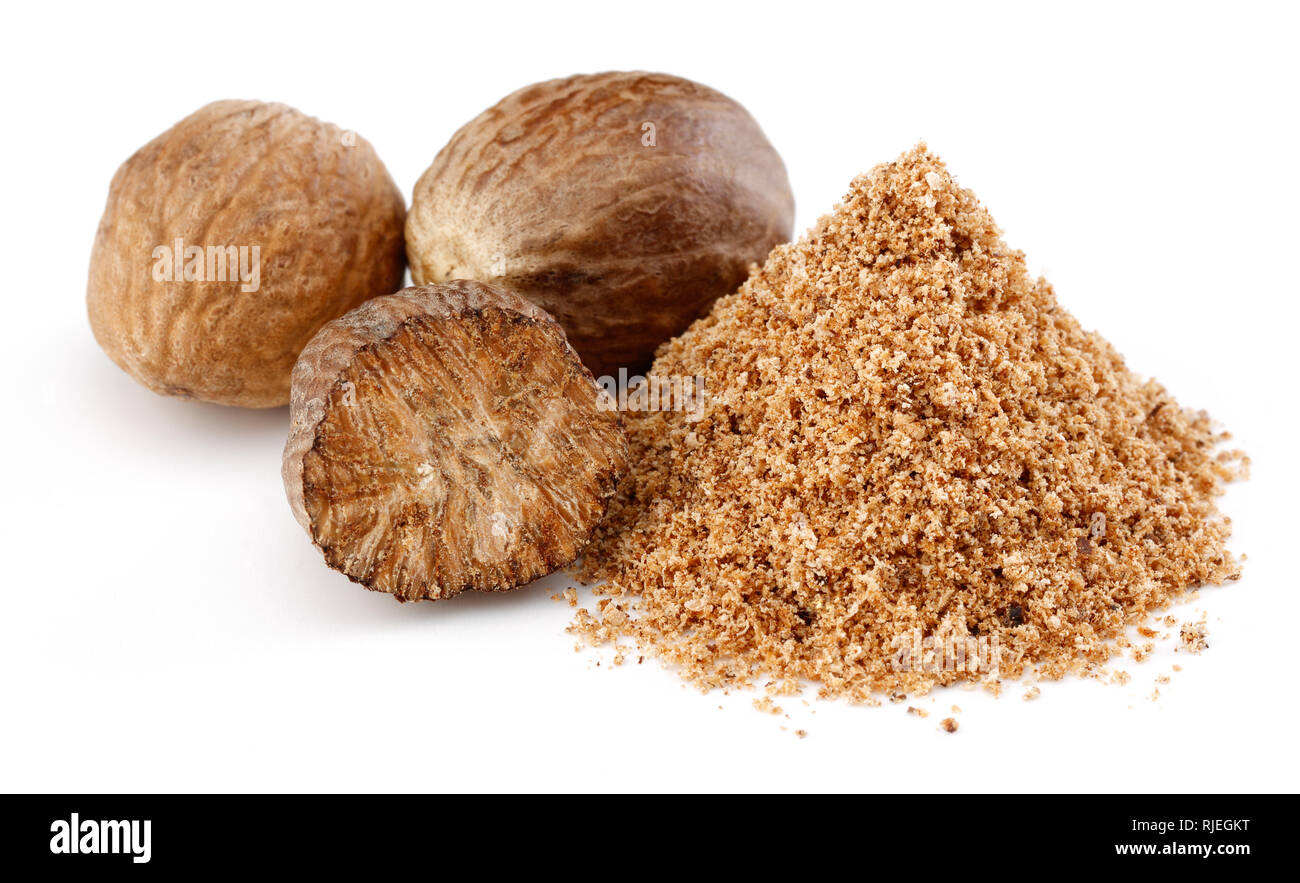 Whole and grated nutmeg isolated on white background Stock Photo - Alamy