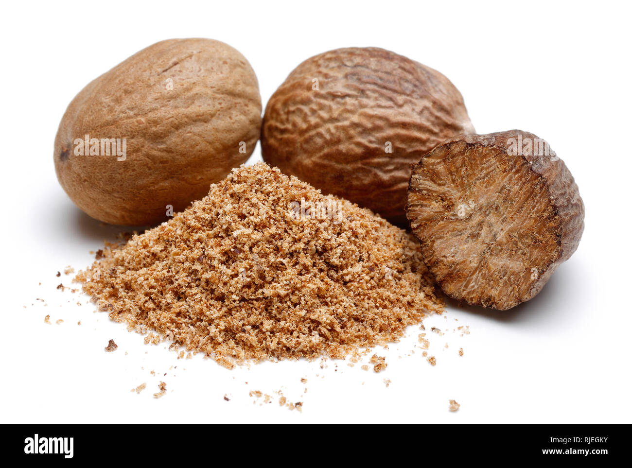 Whole and grated nutmeg isolated on white background Stock Photo - Alamy