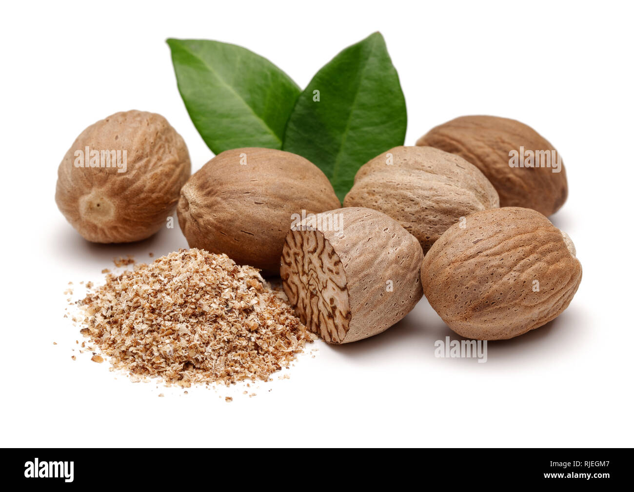 Whole and grated nutmeg with leaf isolated on white background Stock ...