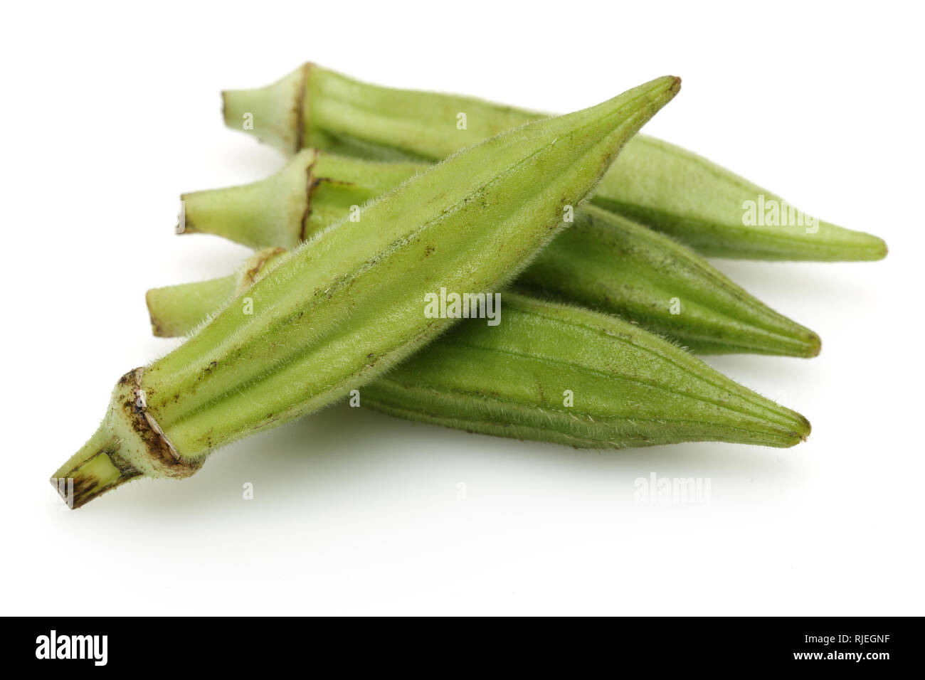 Fresh green okra isolated on white background Stock Photo - Alamy