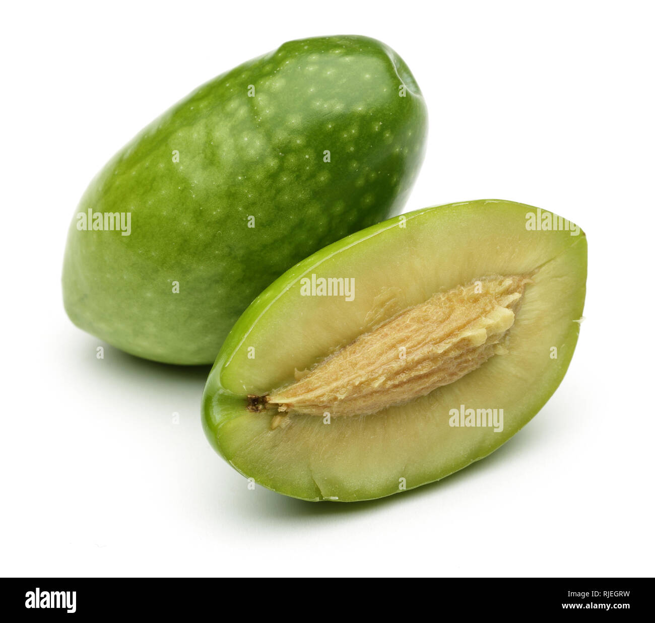 Green olive with half isolated on white background Stock Photo - Alamy