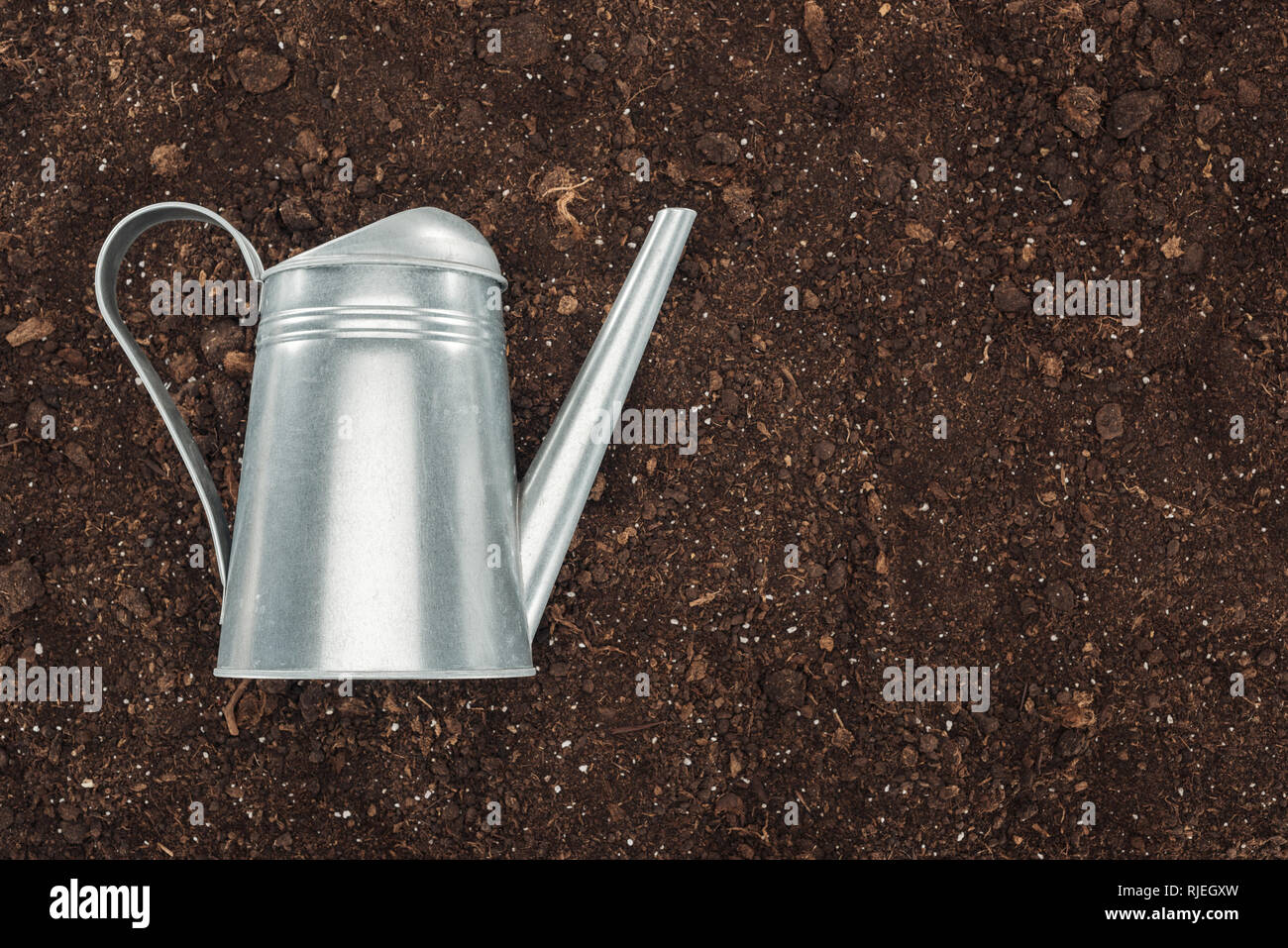 top view of watering can on ground, protecting nature concept Stock ...