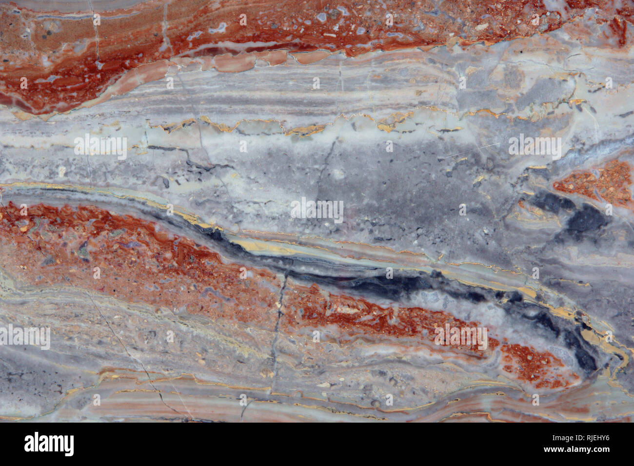 Natural stone Italian marble with gray, white and red stains, called ...