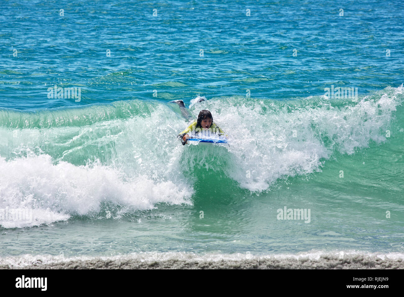 Boy boogie boarding hi-res stock photography and images - Alamy