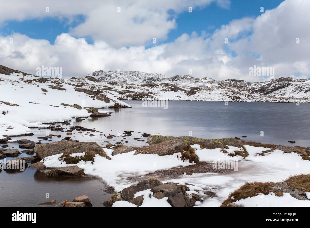 Sprinkling Tarn in snow - Lake District Cumbria Stock Photo - Alamy