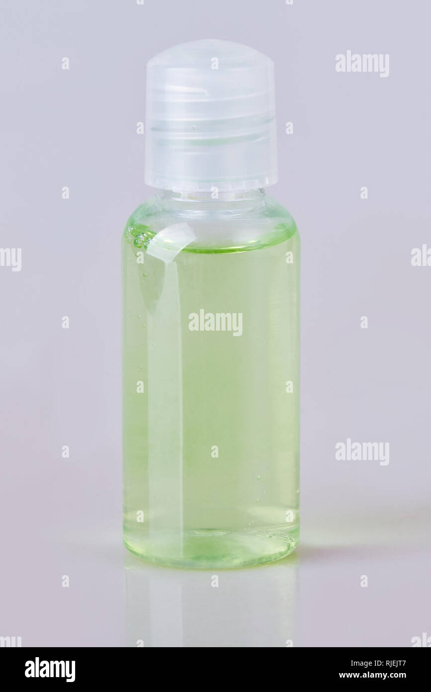 Hotel green bathroom shampoo, shower gel, lotion in a small transparent ...