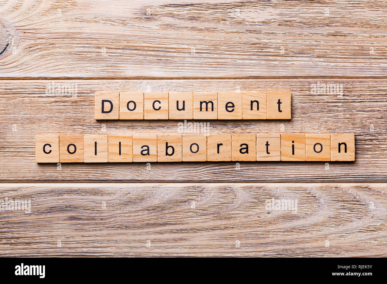 Document Collaboration word written on wood block. Document ...
