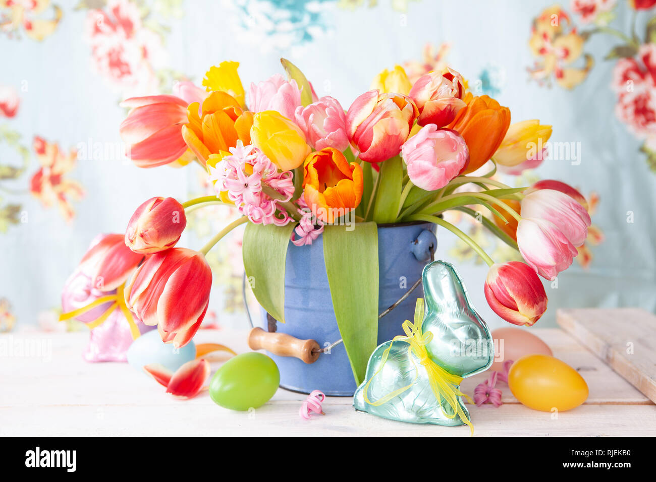 Colorful spring flowers in a little vintage bucket Stock Photo - Alamy
